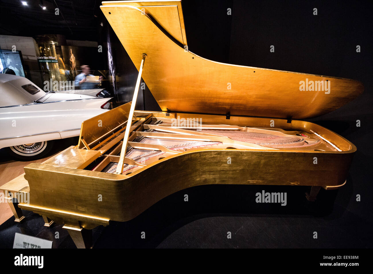 Museum display of the gold grand piano owned by Elvis Presley on ...