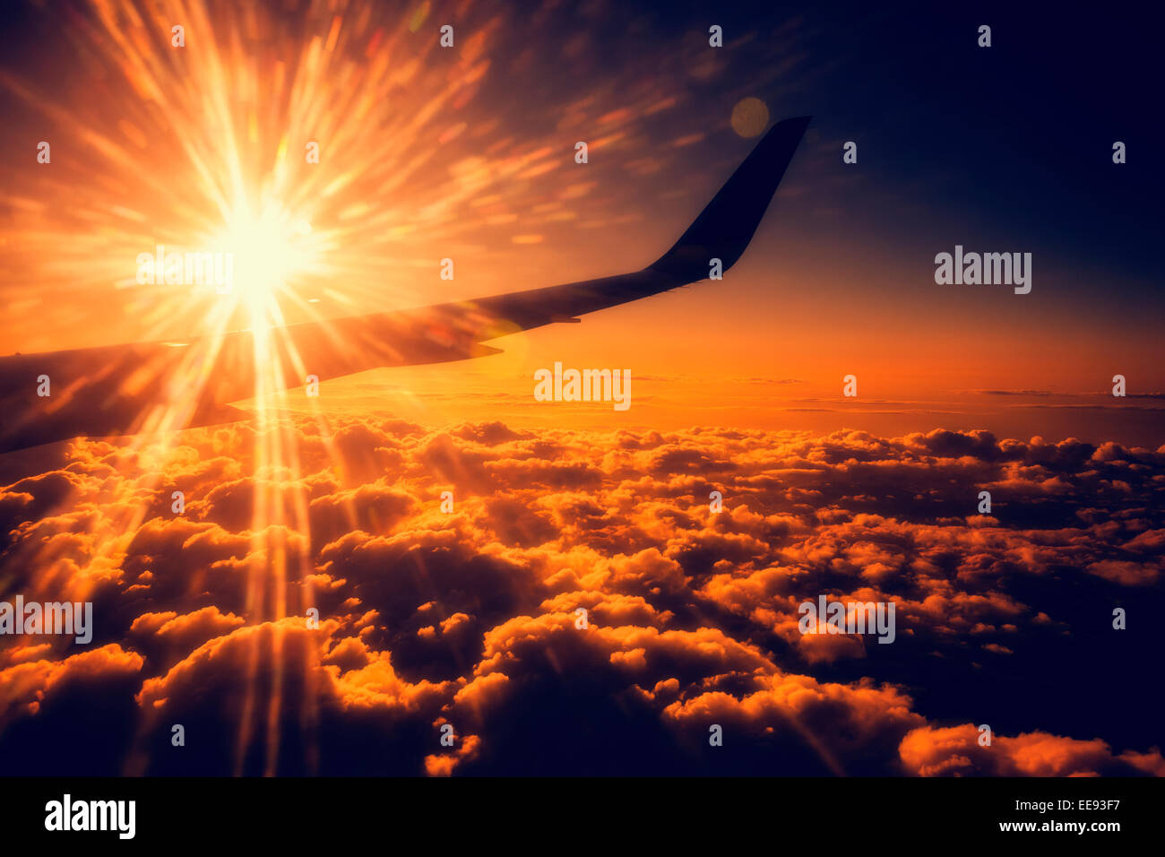 view of airplane wing in the air from inside cabin Stock Photo - Alamy
