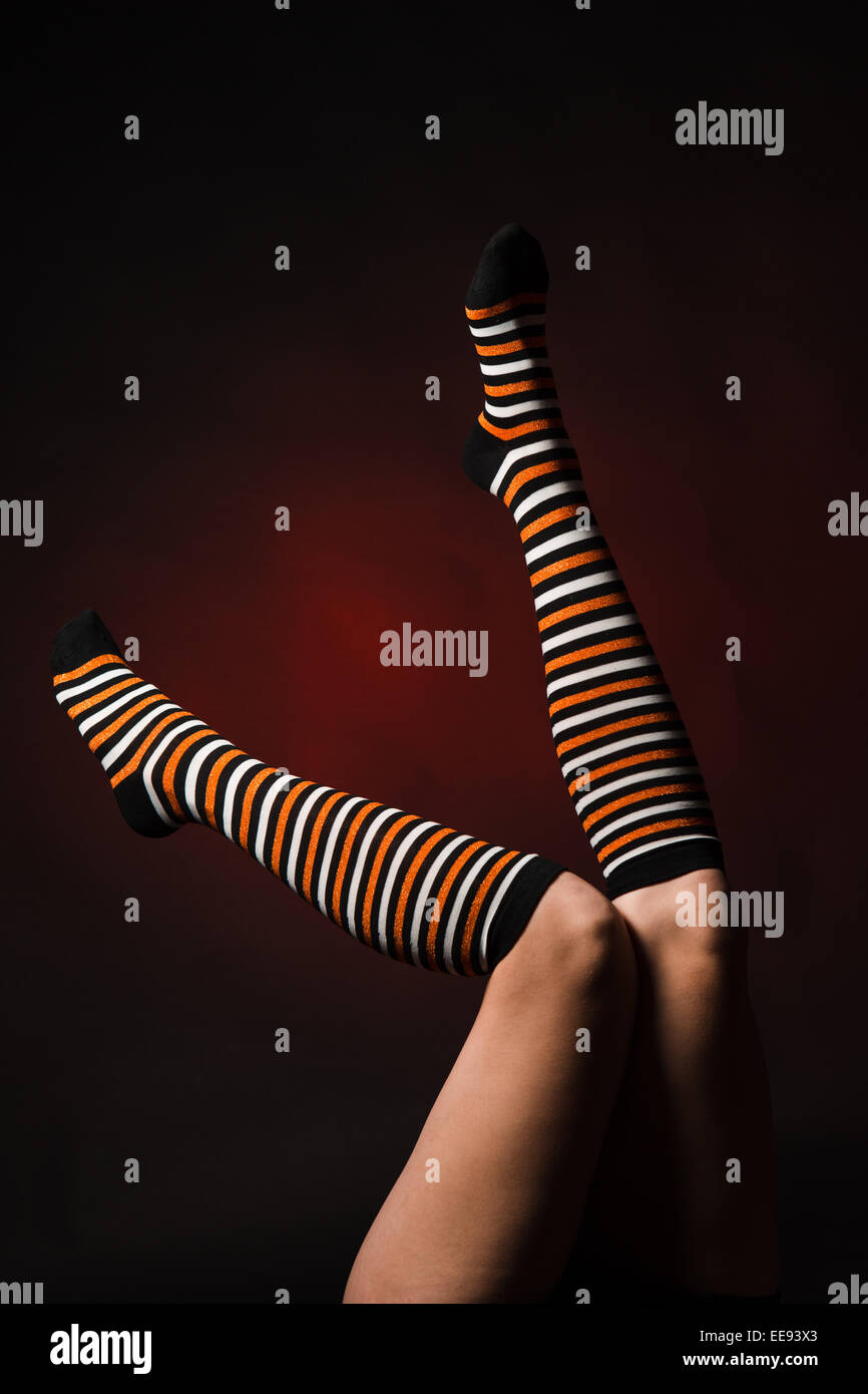 Pretty legs in a long multi-colored socks Stock Photo - Alamy