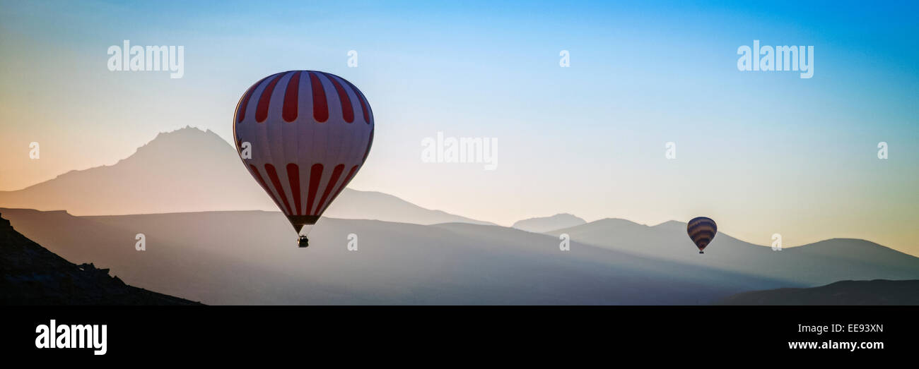Two hot air balloons floating Stock Photo - Alamy