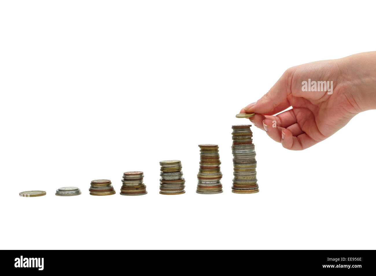 woman hand putting money coins to stack over white Stock Photo - Alamy