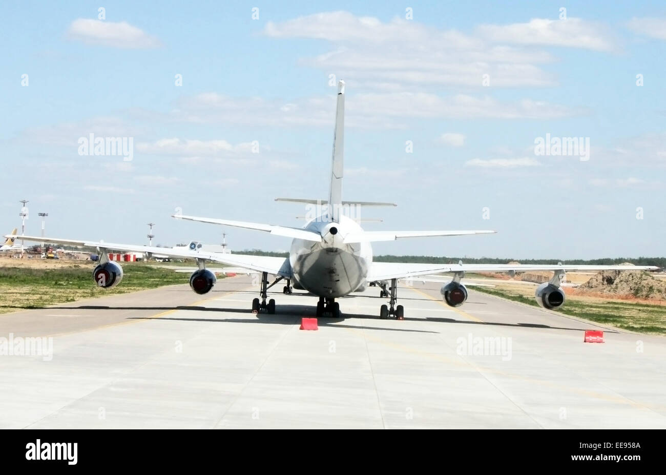 An airplane in the airport, back view Stock Photo - Alamy