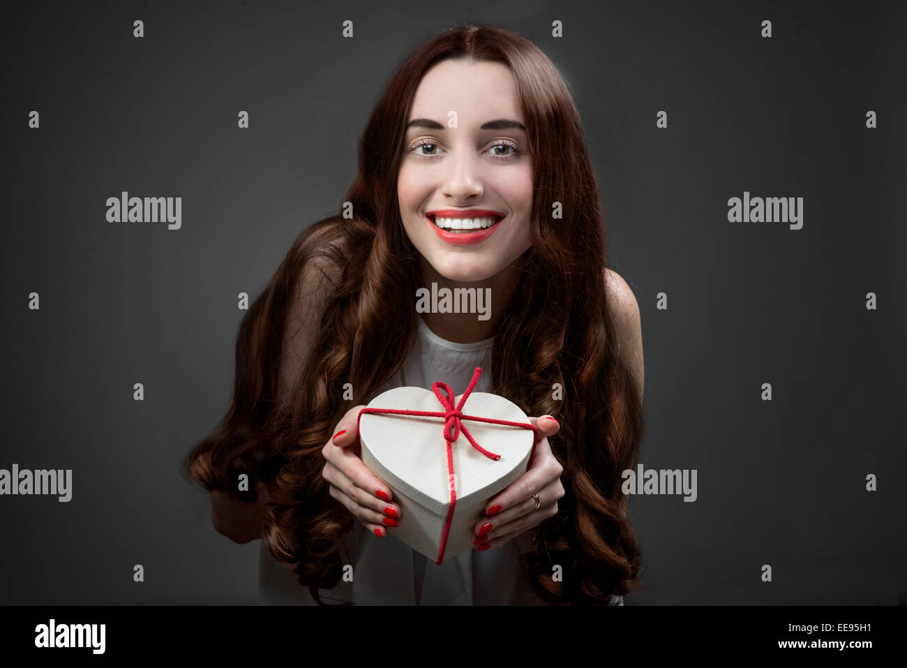 Woman with heart box Stock Photo - Alamy