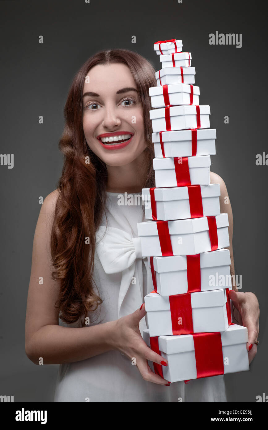 Woman with present boxes Stock Photo - Alamy