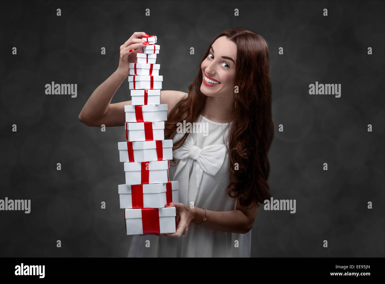Woman with present boxes Stock Photo - Alamy