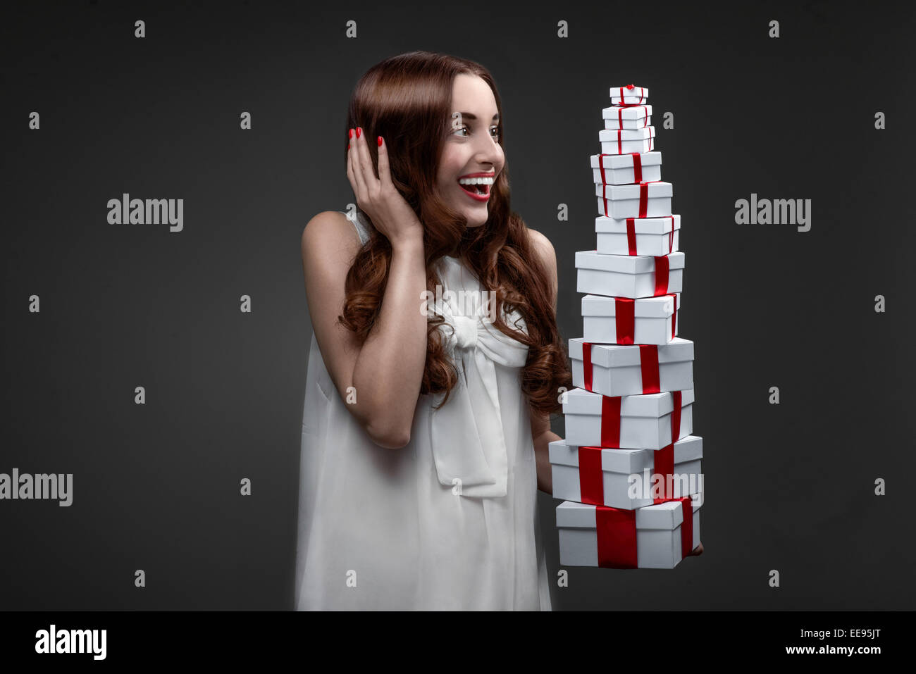 Woman with present boxes Stock Photo - Alamy