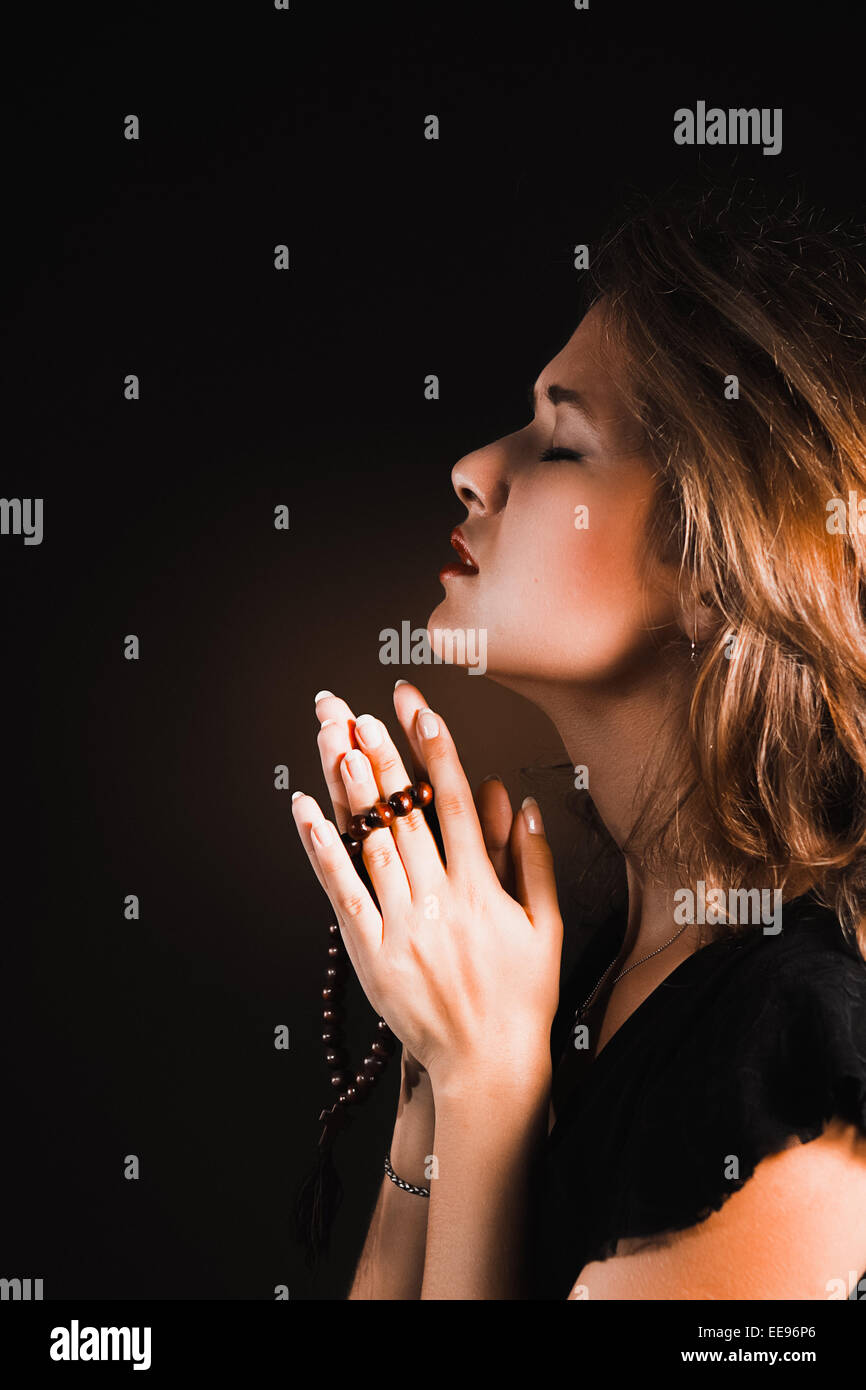 Girl praying kneeling church hi-res stock photography and images - Alamy