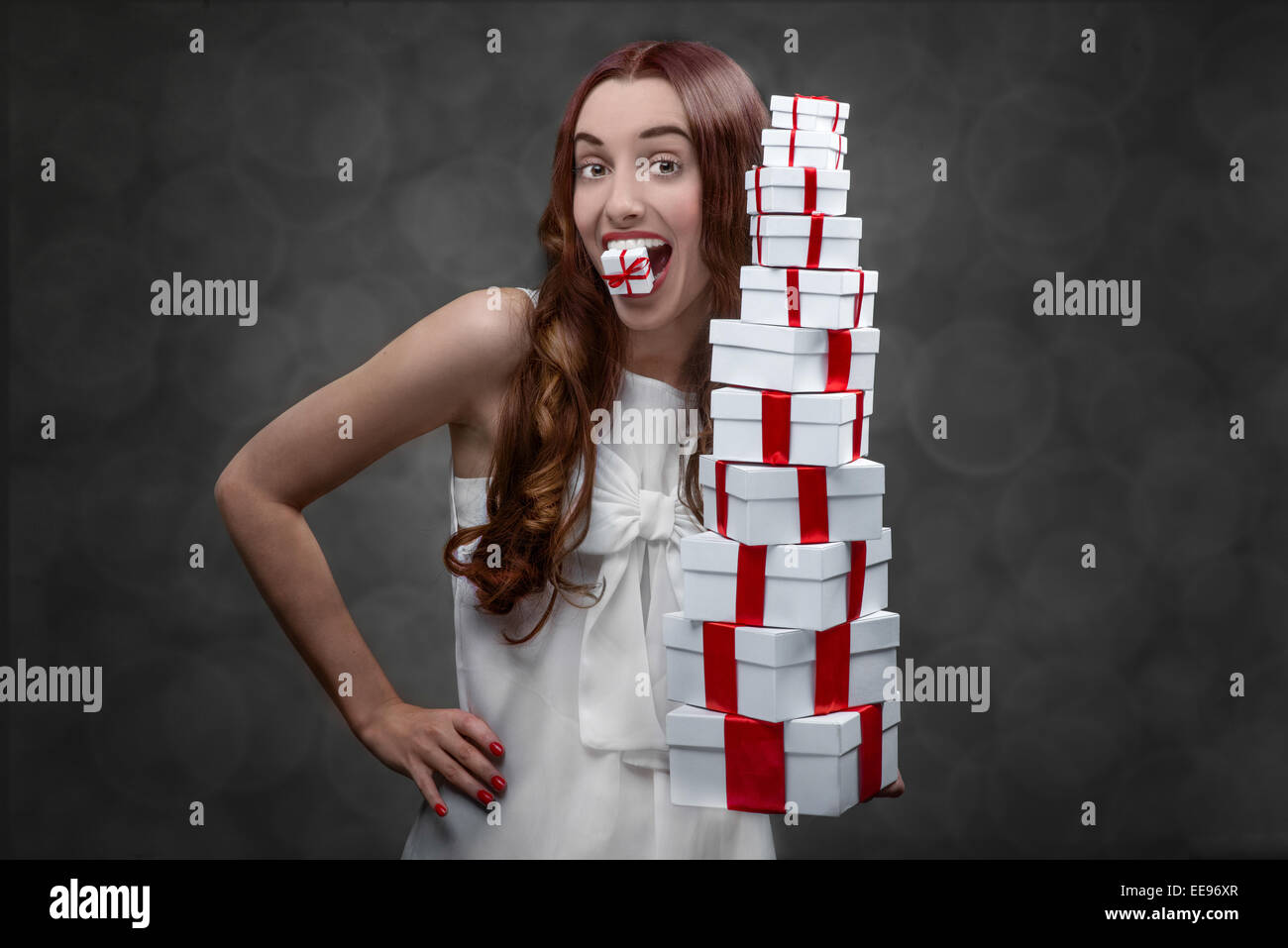 Woman with present boxes Stock Photo - Alamy