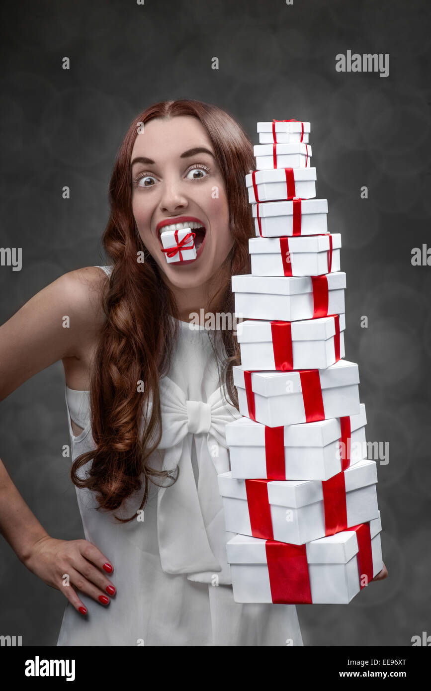 Woman with present boxes Stock Photo - Alamy