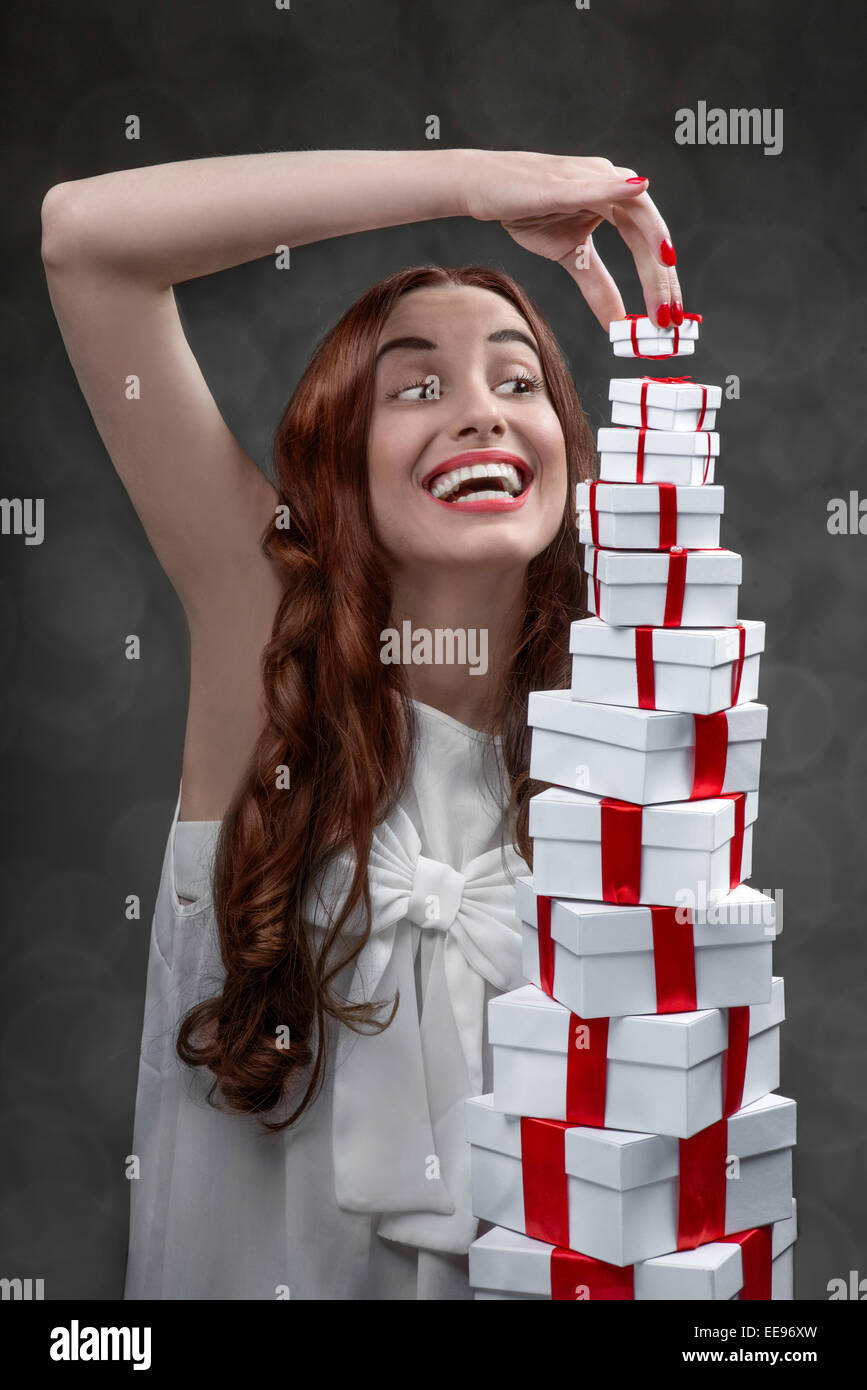 Woman with present boxes Stock Photo - Alamy