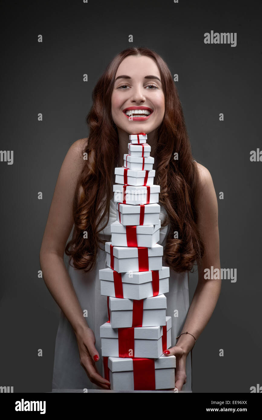 Woman with present boxes Stock Photo - Alamy