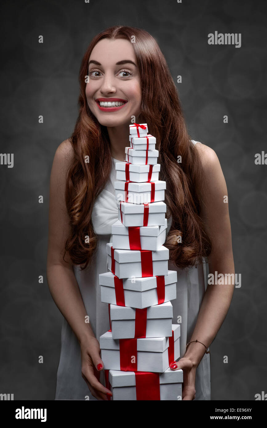 Woman with present boxes Stock Photo - Alamy