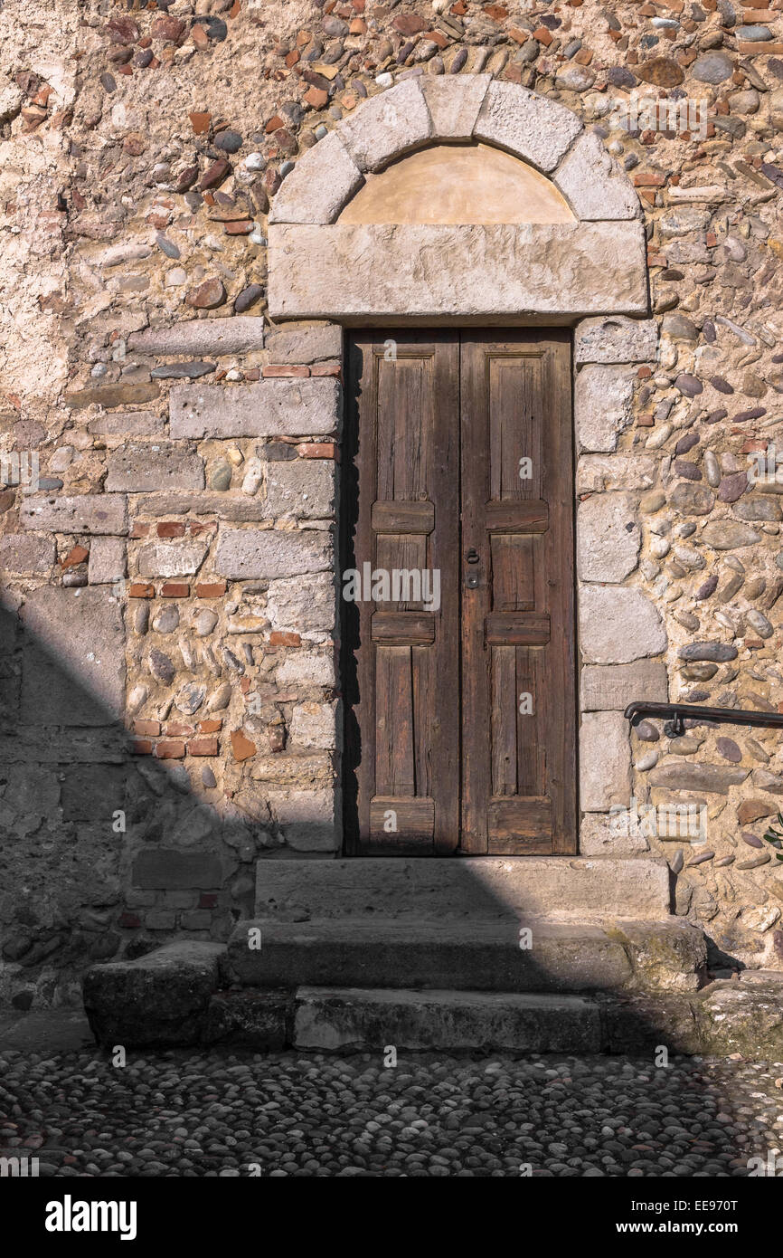 A side entrance to an ancient italian church medieval Stock Photo - Alamy
