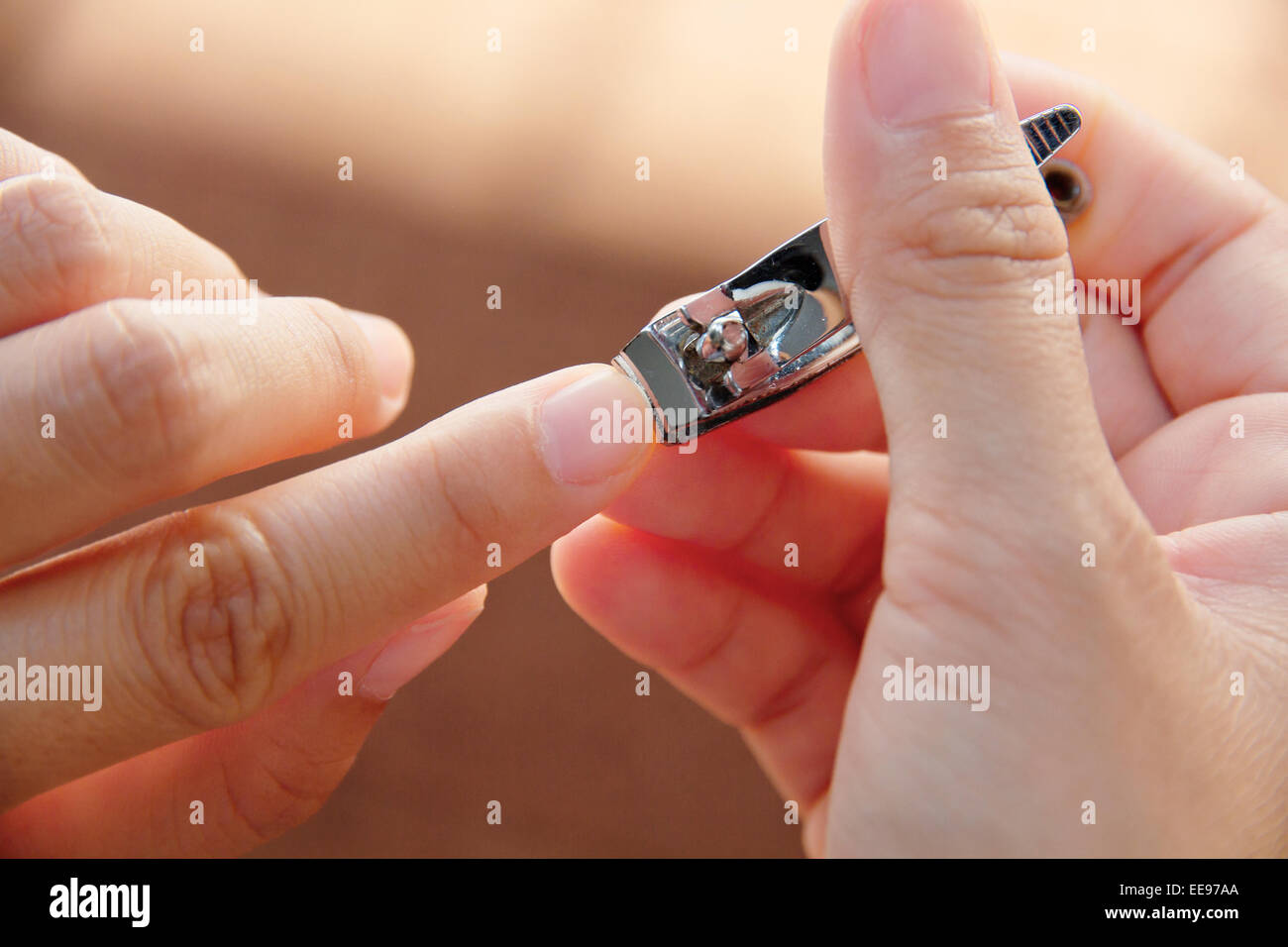 hand manicure with nail clipper Stock Photo - Alamy