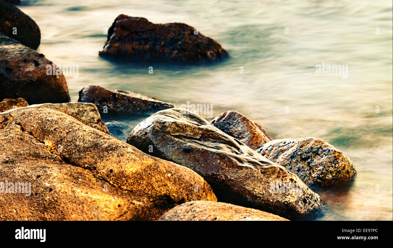 Sleeping sea with coastal rocks, abstract natural landscape Stock Photo ...