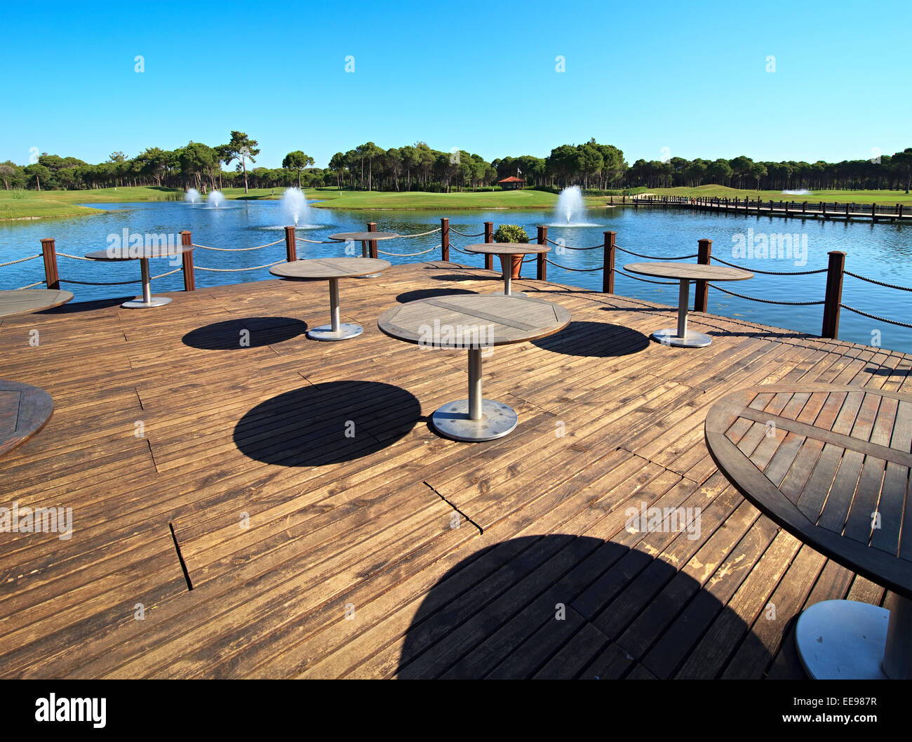 Cafe on the artificial pond with fountain Stock Photo - Alamy