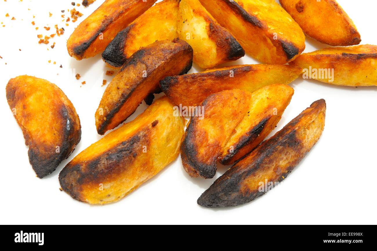 Burnt Potato wedges on a white background Stock Photo - Alamy