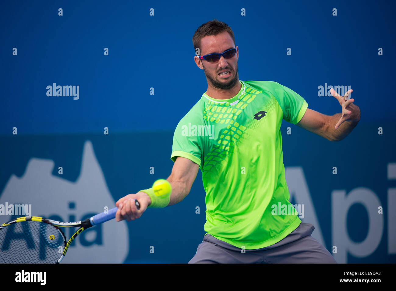 Sydney, Australia. 14th Jan, 2015. Viktor Troicki from Serbia hitting a ...