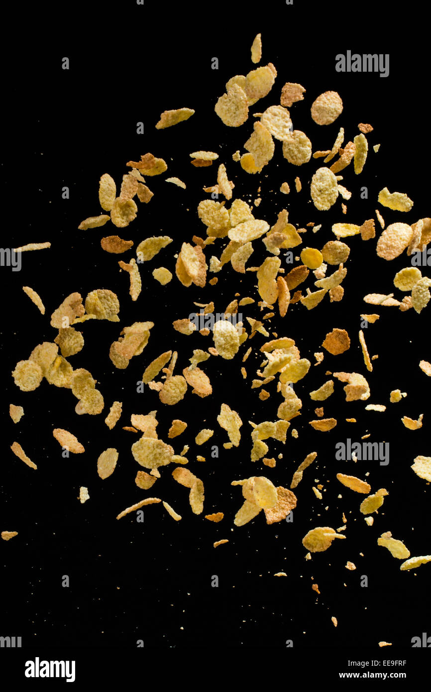 Flying corn flakes isolated on black background Stock Photo - Alamy