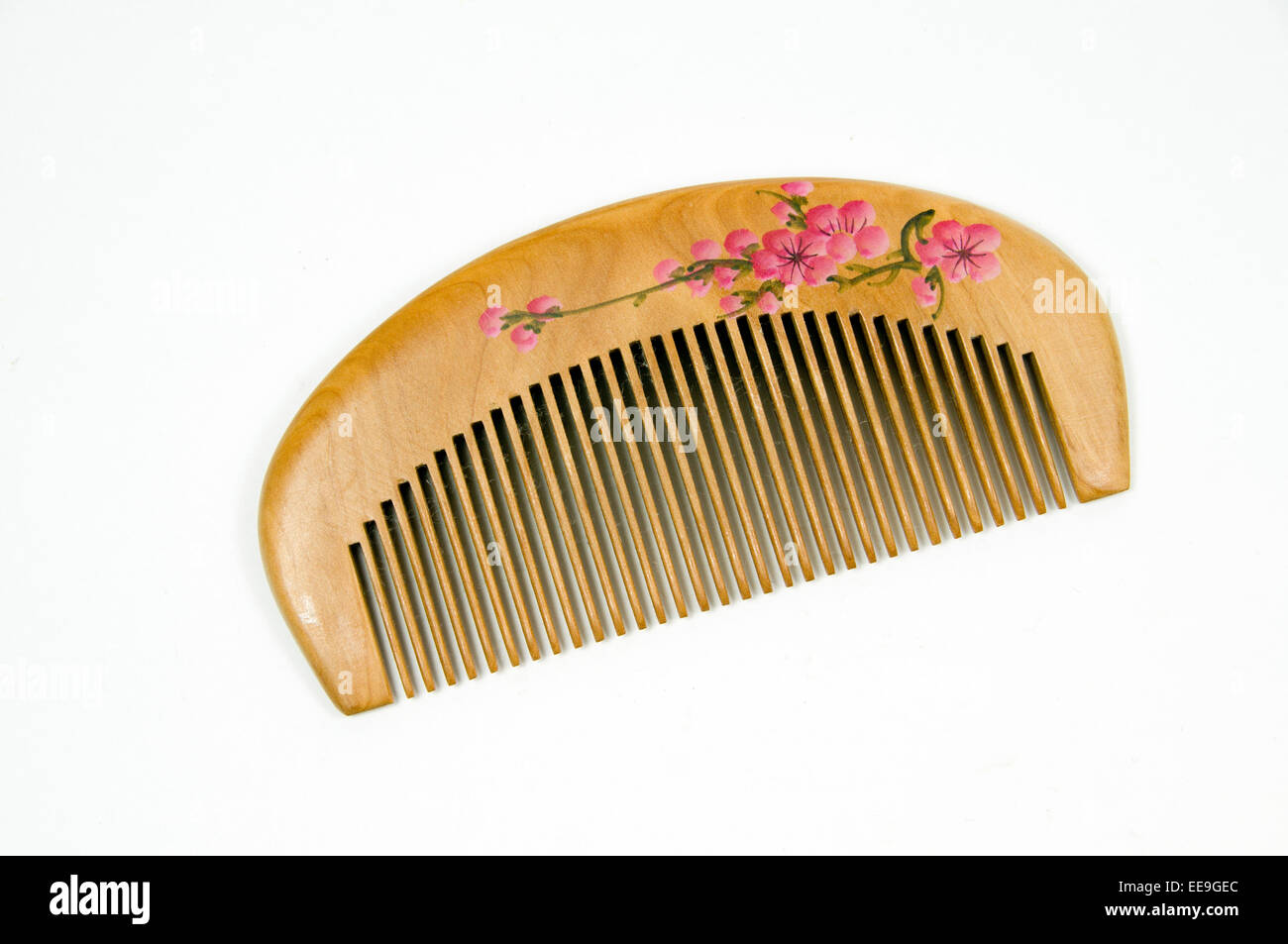 Comb with flowers painted on it Stock Photo - Alamy