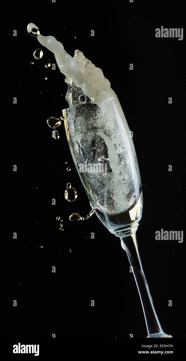 Glass of champagne with splash, isolated on black background Stock ...