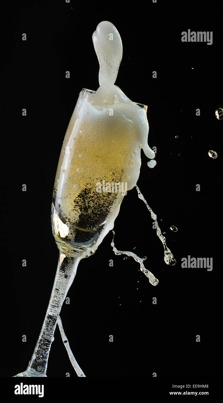 Glass of champagne with splash, isolated on black background Stock ...