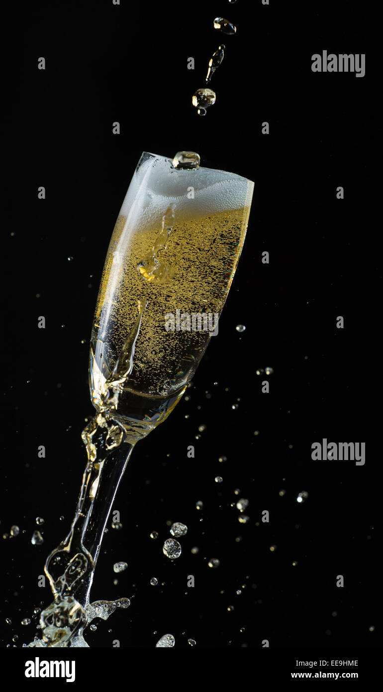 Glass of champagne with splash, isolated on black background Stock ...