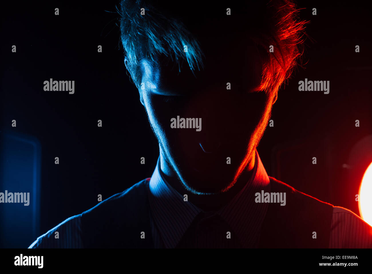 Style man silhouette portrait with red and blue filters Stock Photo - Alamy