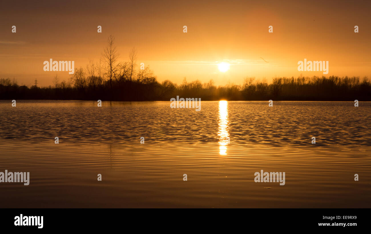 Lake at sunset Stock Photo - Alamy