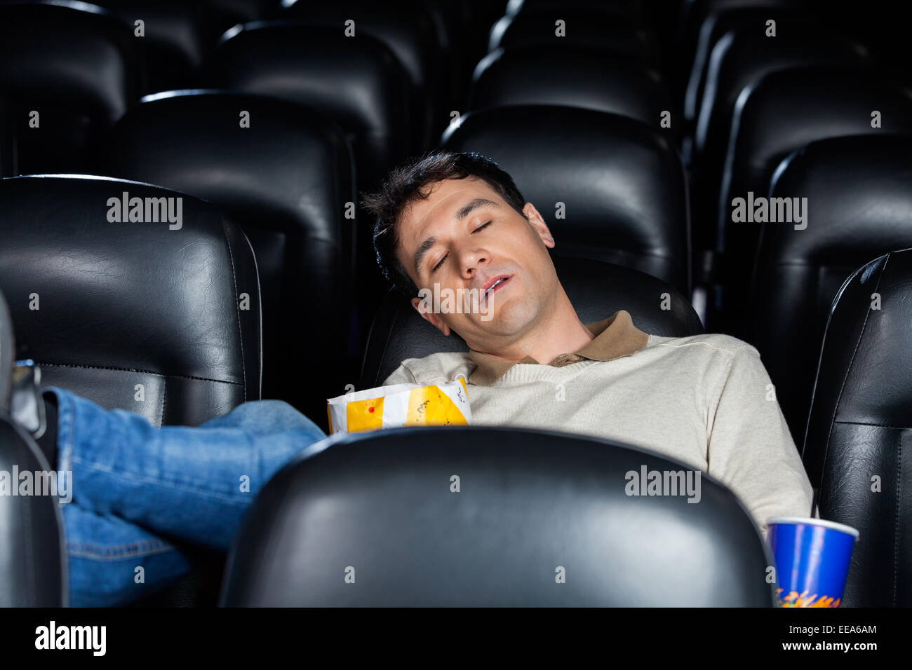 Bored Man Sleeping At Theater Stock Photo - Alamy