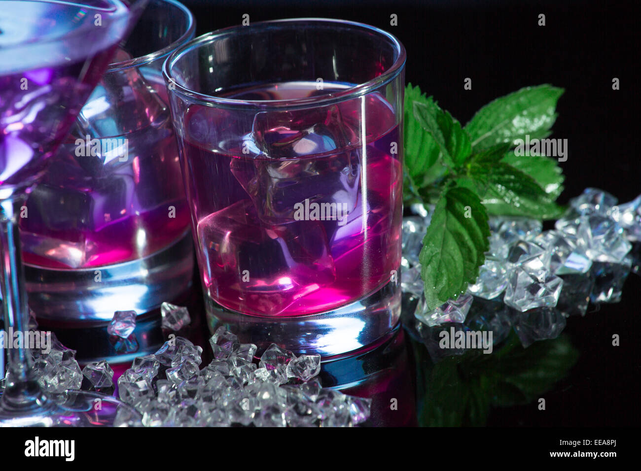 Violet coctail with ice cubes Stock Photo - Alamy