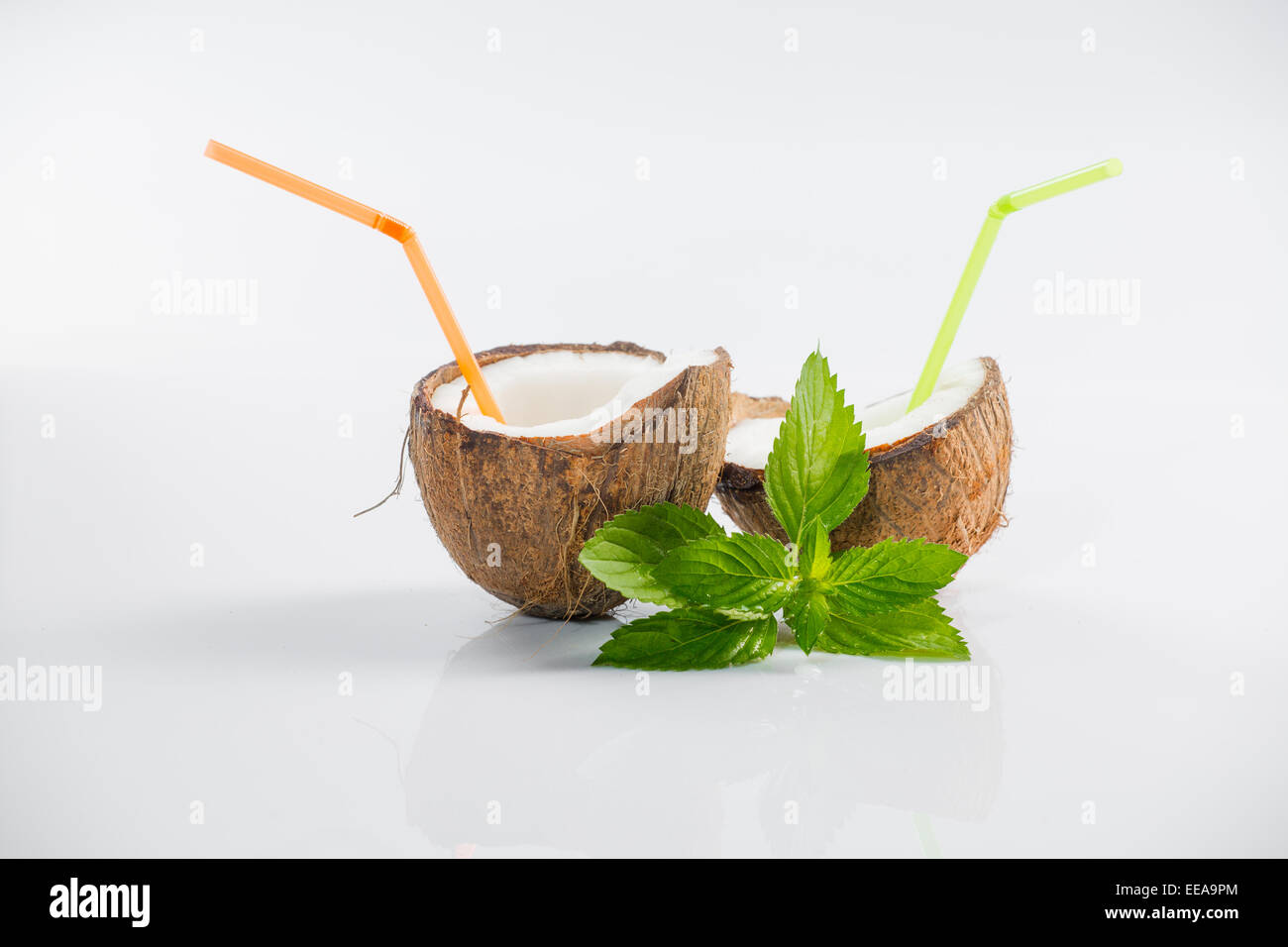 Coconut cocktail on white background with mint Stock Photo - Alamy