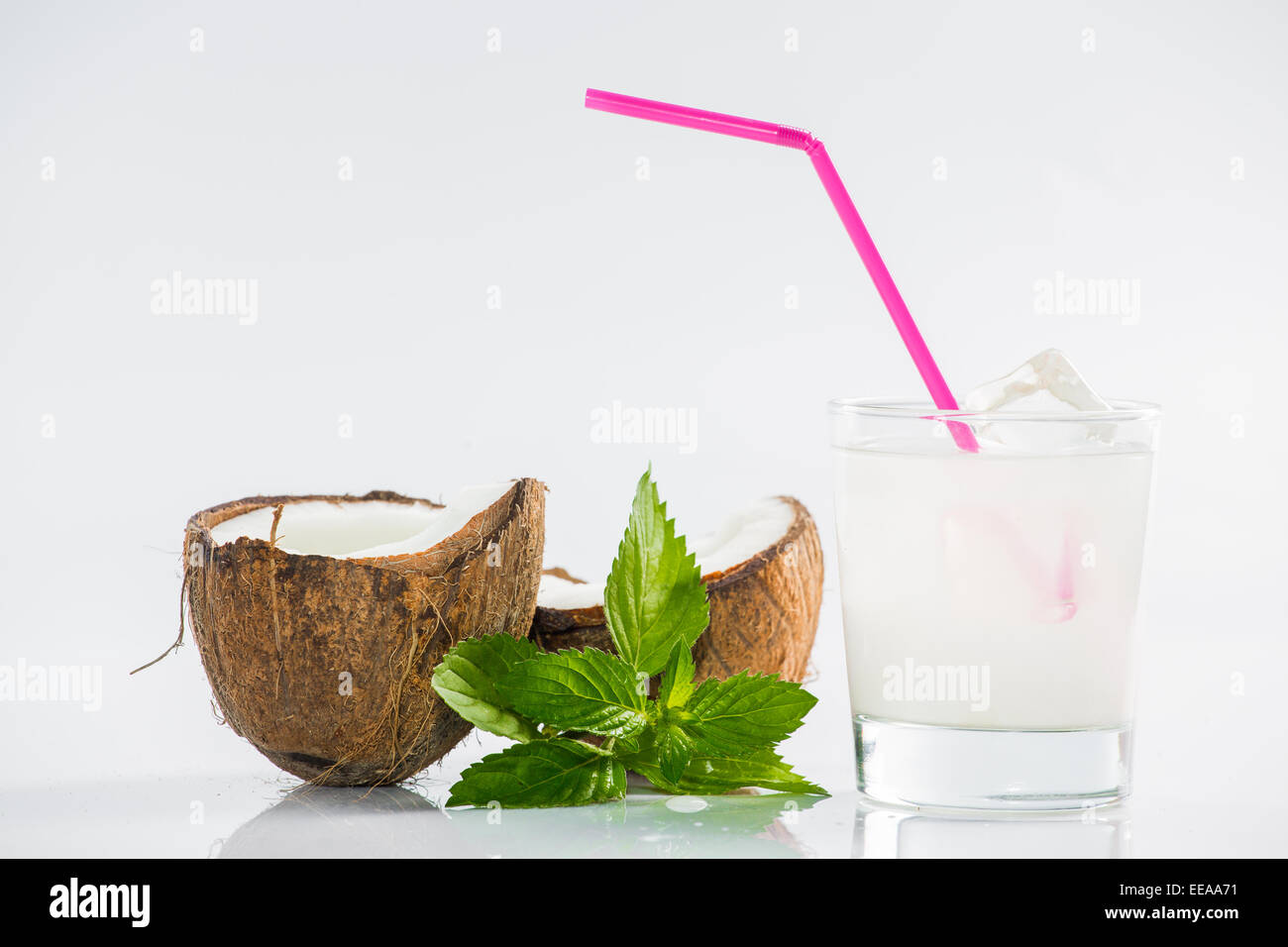 Coconut cocktail on white background with mint Stock Photo - Alamy