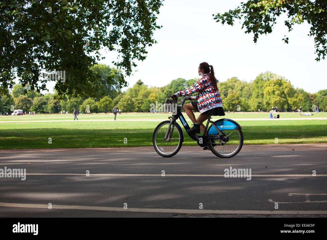 Women riding a Boris bike at Hyde park London Stock Photo - Alamy