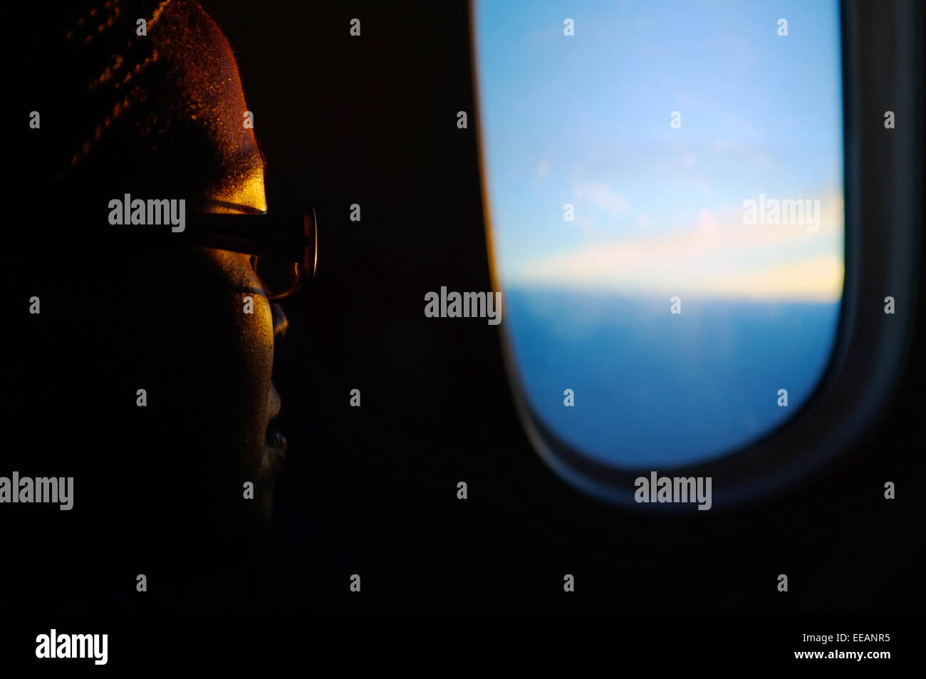 An airline passenger looks out of the window of a Boeing 787 Dreamliner ...