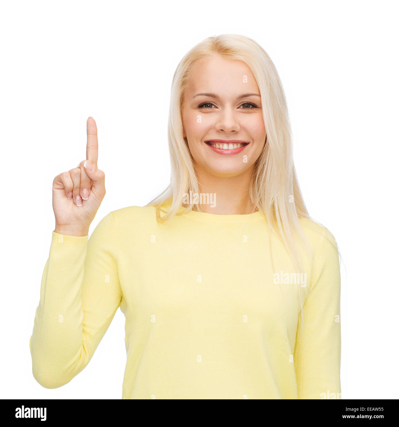 smiling woman pointing her finger up Stock Photo - Alamy