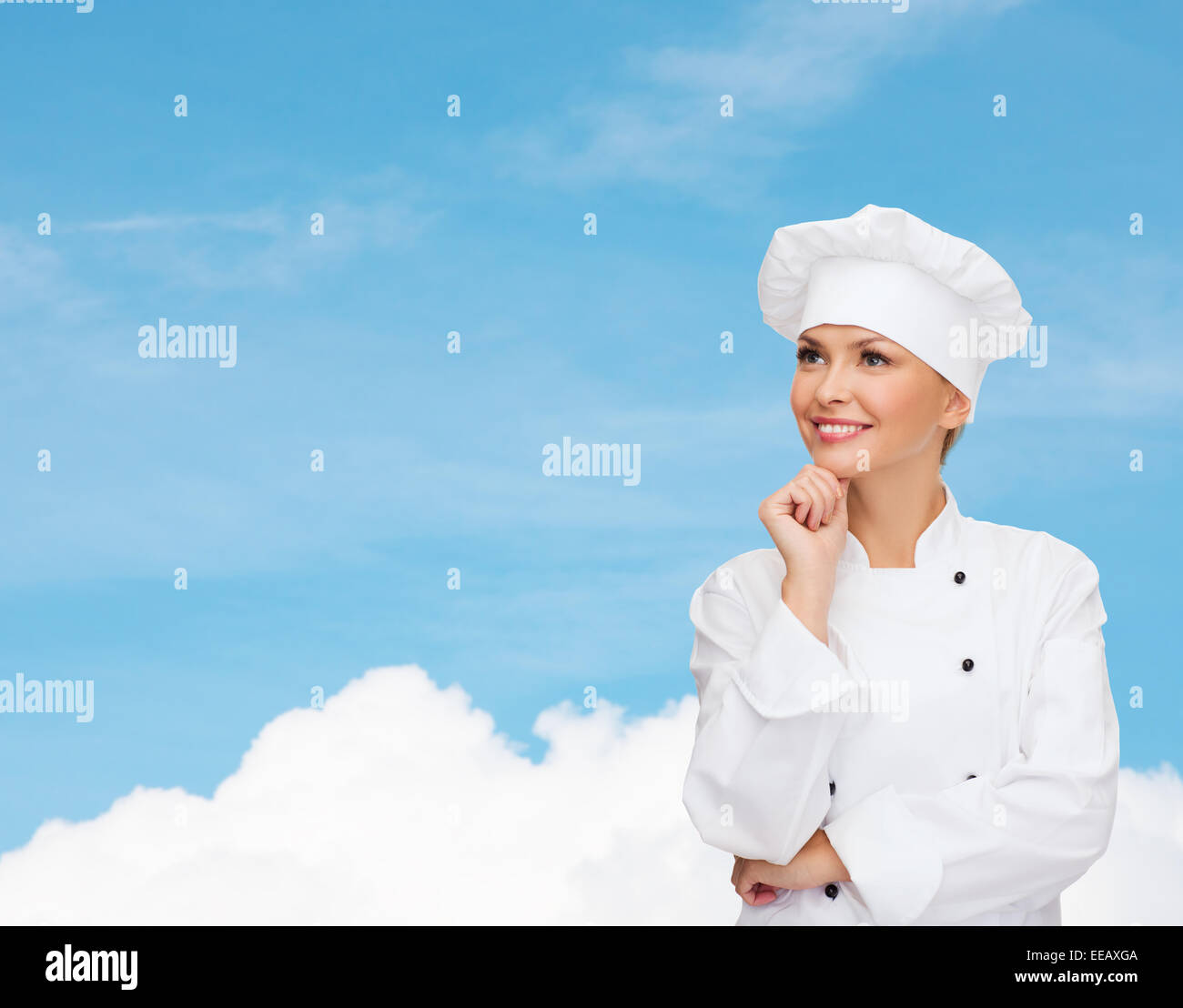 smiling female chef dreaming Stock Photo - Alamy