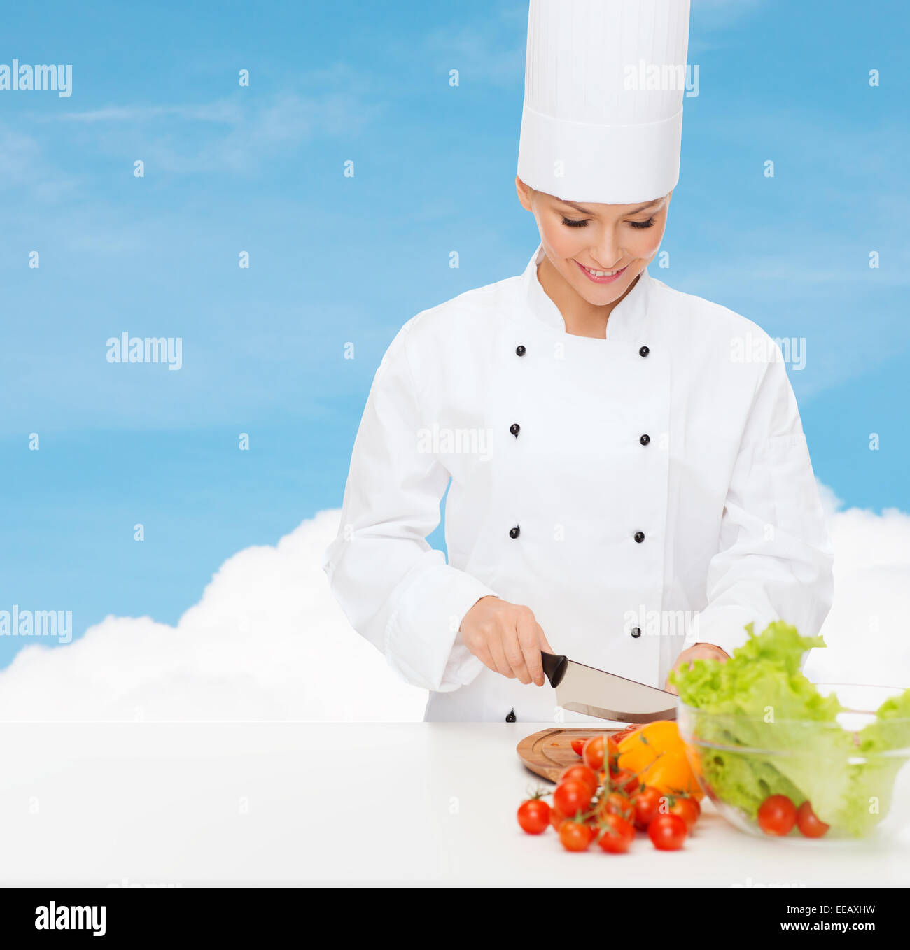 smiling female chef chopping vegetables Stock Photo - Alamy