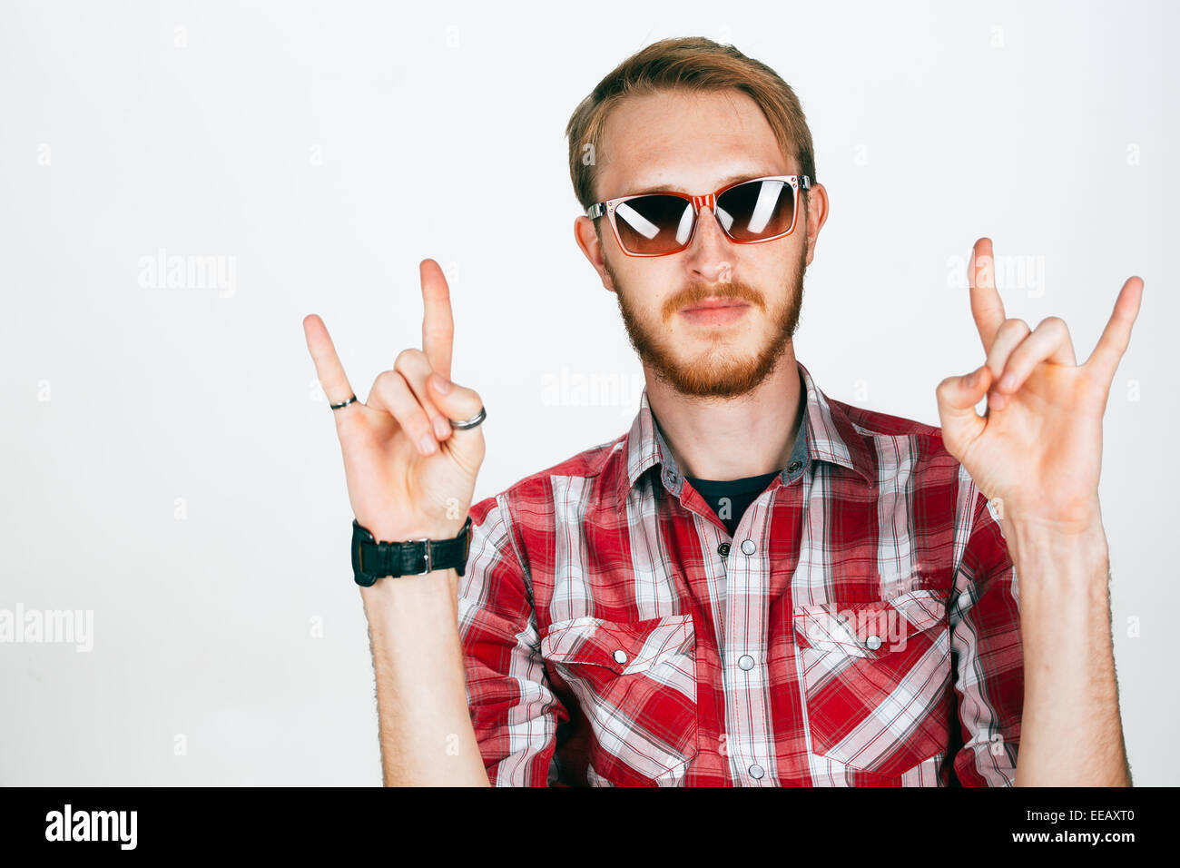 young male showing rock hand isolated on white Stock Photo - Alamy