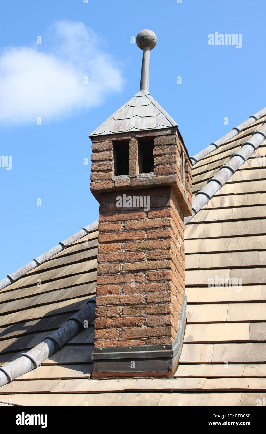 Old traditional rooftop chimney constructed of bricks on a traditional ...