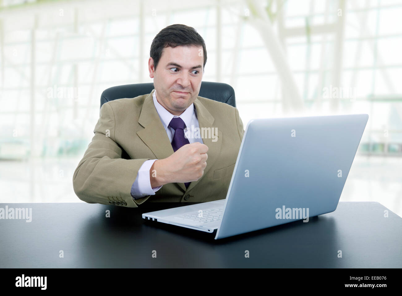 mad businessman working with is laptop, at the office Stock Photo - Alamy