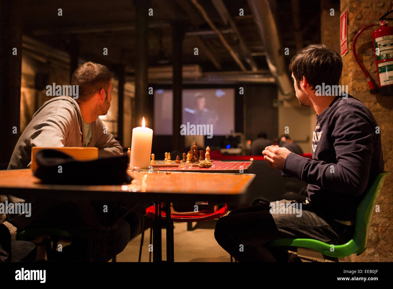 Barcelona, Spain. 27th Dec, 2015. Customers play a round of chess at ...