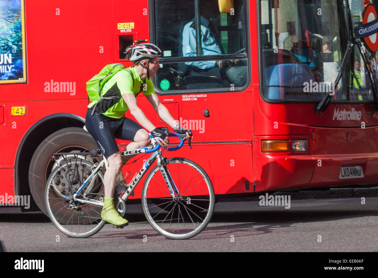 Cyclist cycling busy traffic bus hi-res stock photography and images - Alamy