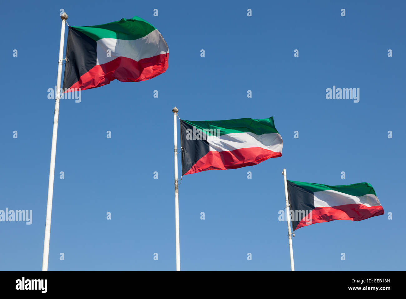 Three national flags of Kuwait waving in the wind Stock Photo - Alamy