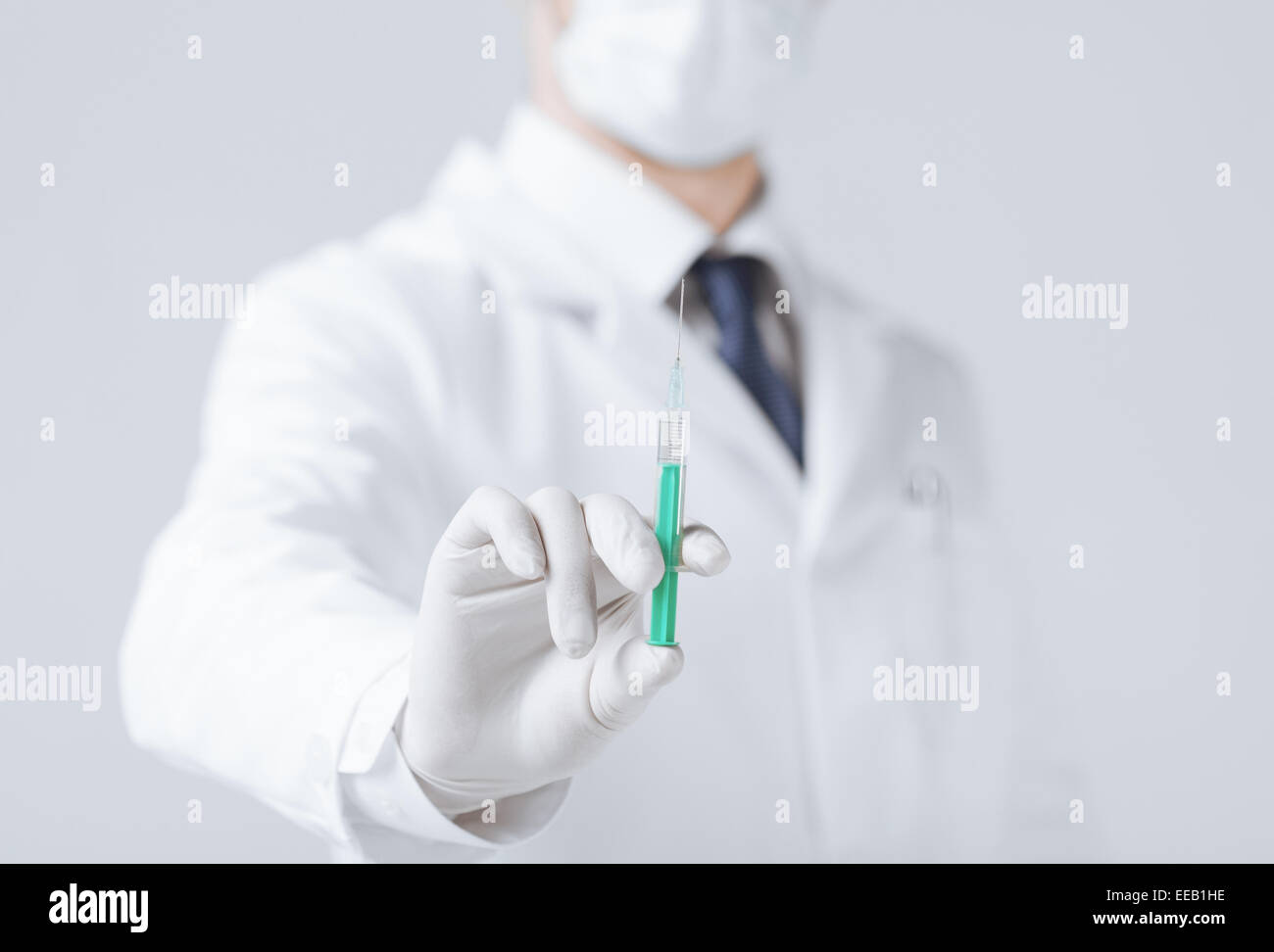 male doctor holding syringe with injection Stock Photo - Alamy