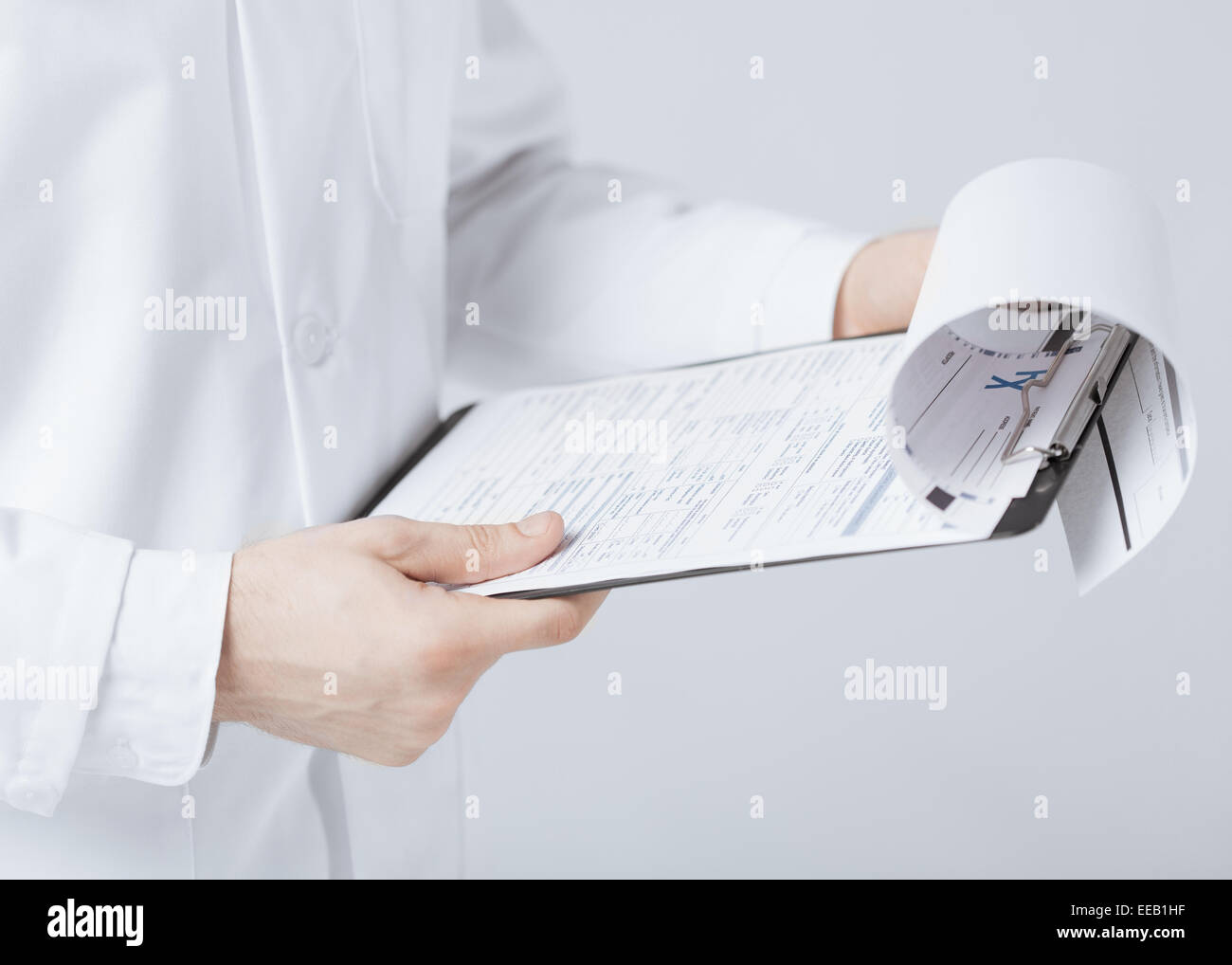 male doctor holding prescription paper in hand Stock Photo - Alamy