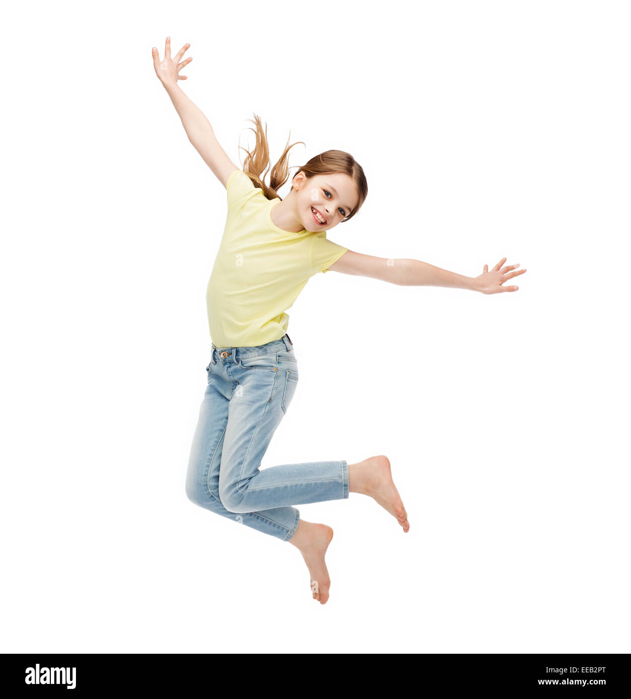 smiling little girl jumping Stock Photo - Alamy