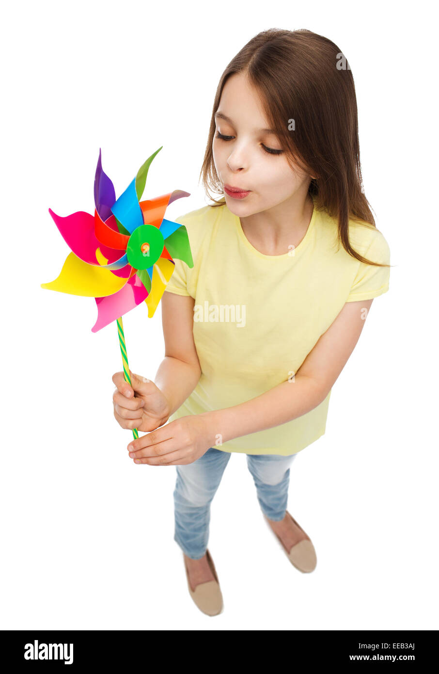 smiling child with colorful windmill toy Stock Photo - Alamy