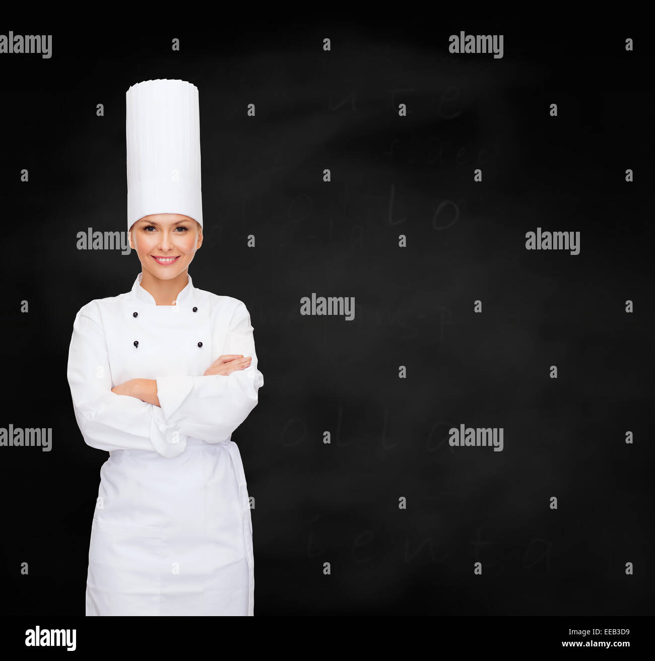 smiling female chef with crossed arms Stock Photo - Alamy