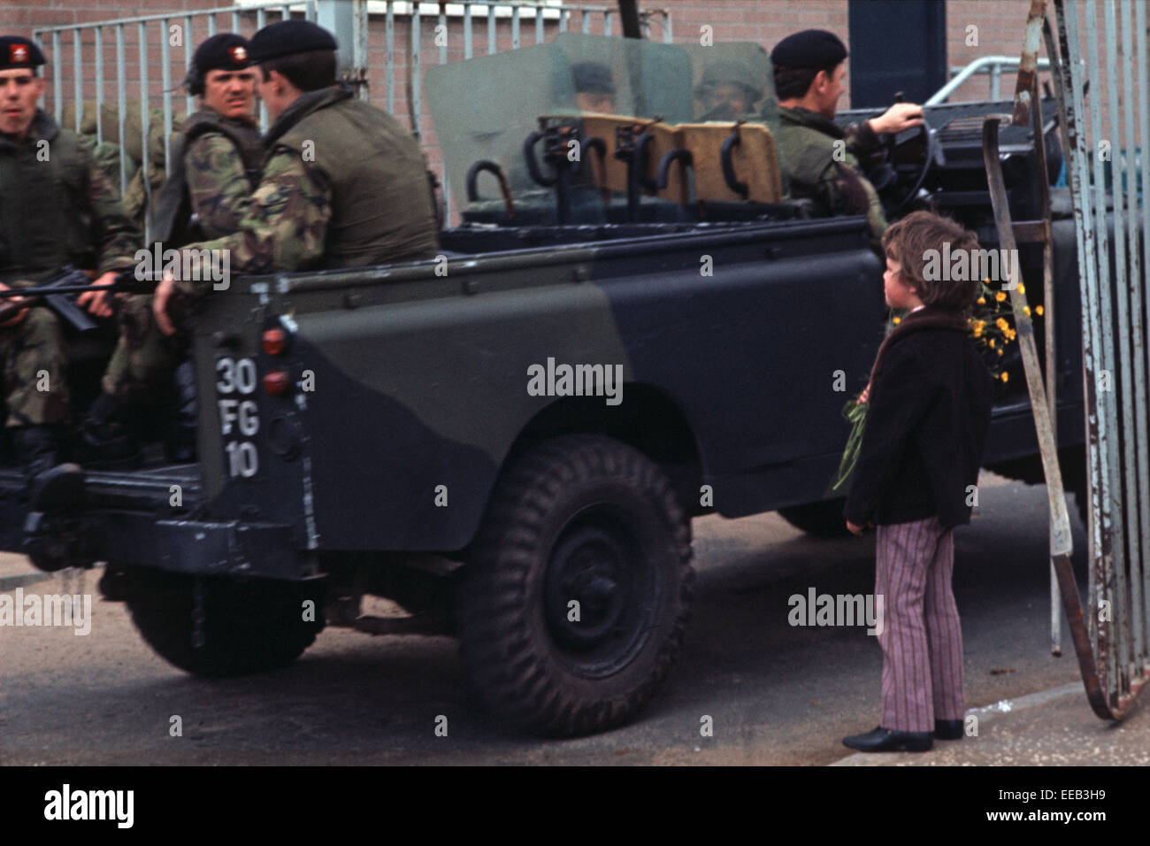 BELFAST, NORTHERN IRELAND - MAY 1972. British Army Soldiers driving ...